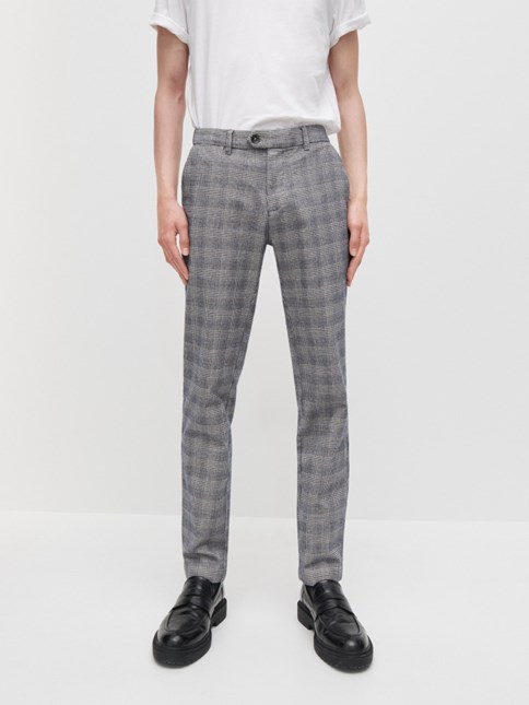 Spodnie w kratę męskie - moda na sezon jesień 2025